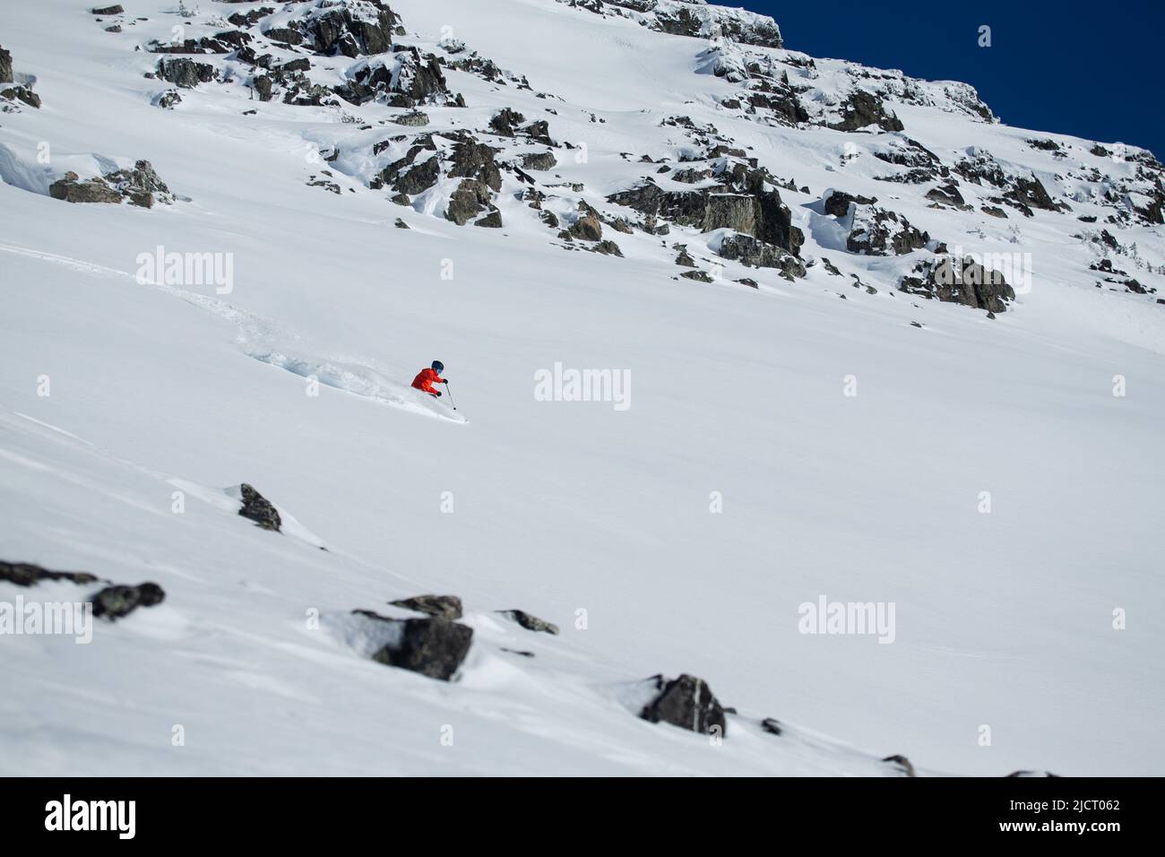 Female skiing down a slope hi-res stock photography and images - Alamy