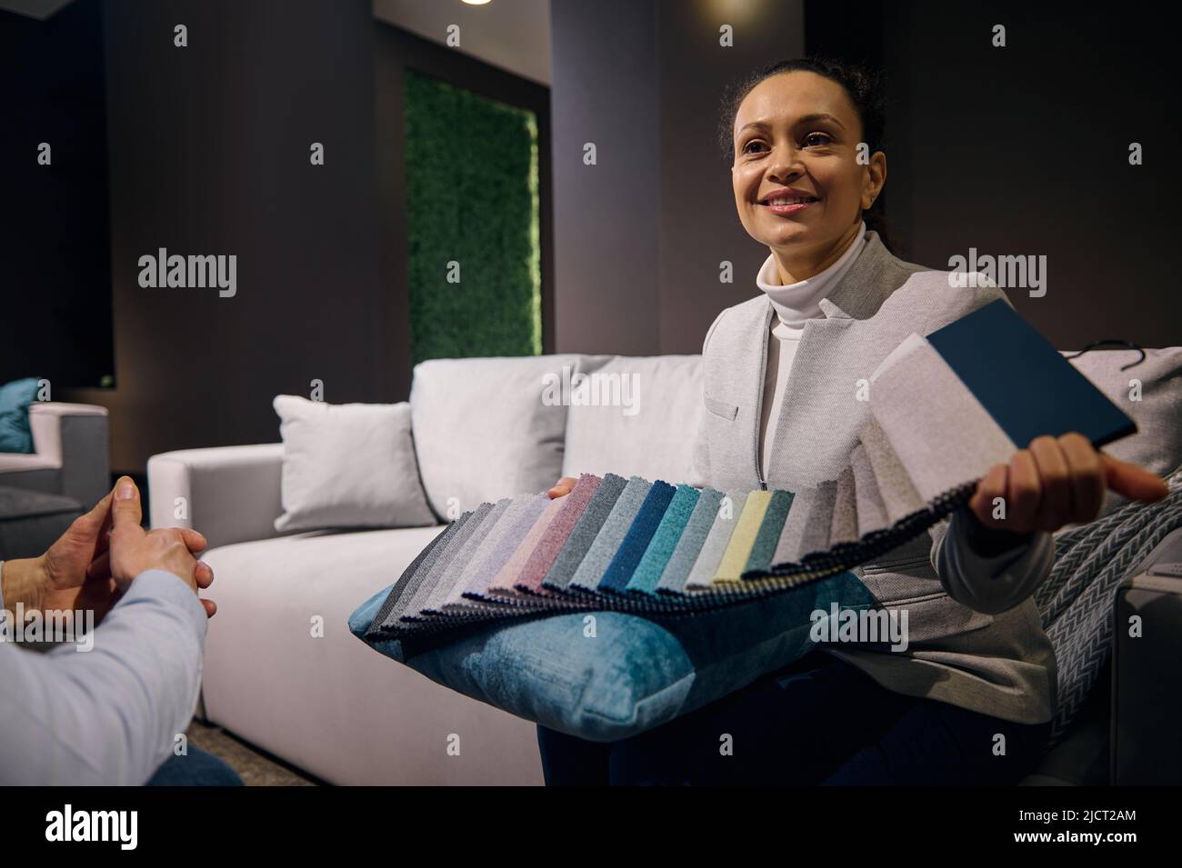 Confident pleasant African American woman, interior designer sales ...