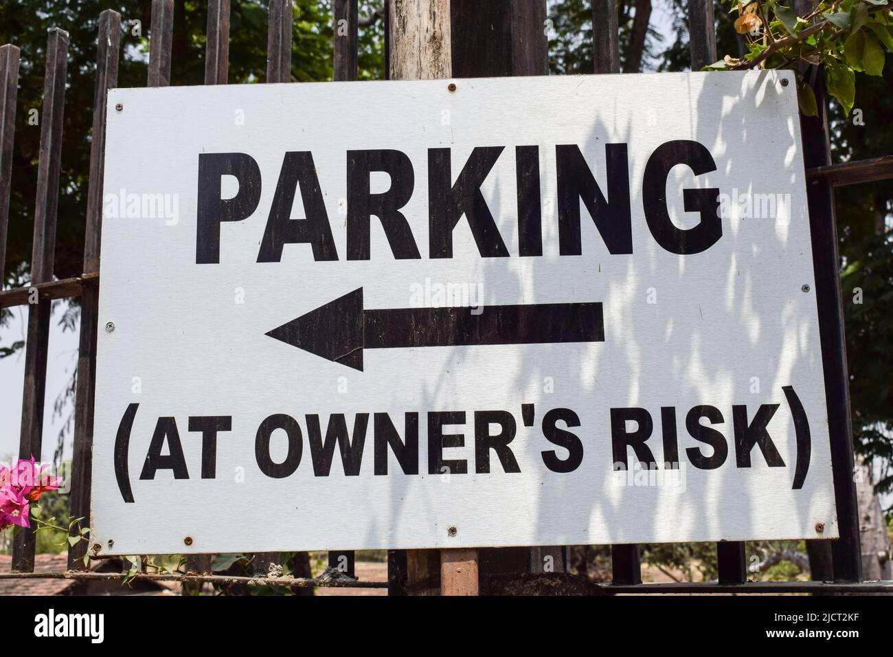 Hoarding board written Parking at owner's risk rule sign placed at ...