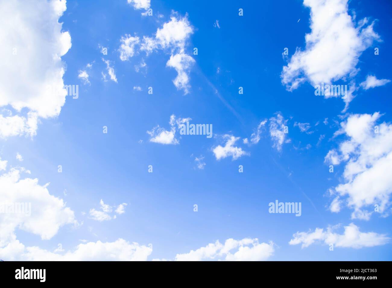 Cumulus clouds. White clouds on a blue background Stock Photo - Alamy
