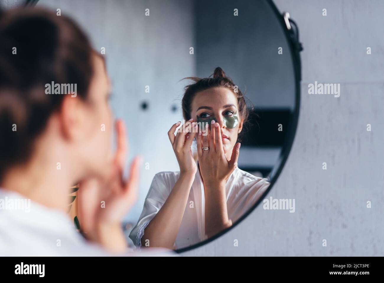 Women's morning facial care, under eye patches Stock Photo - Alamy