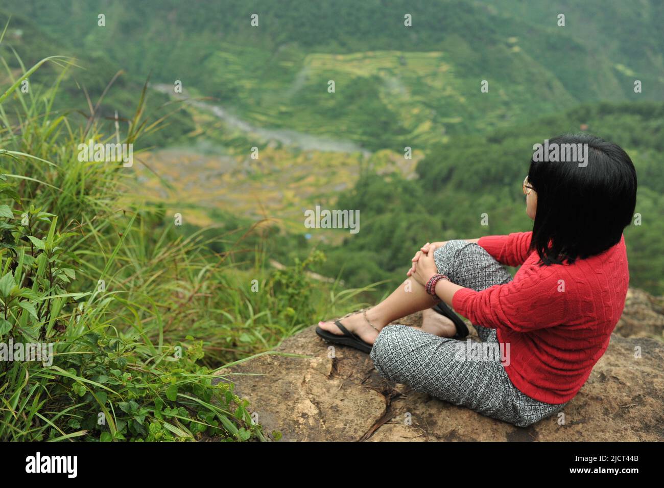 Mountain Province, Philippines: woman sitting on the edge of the ...