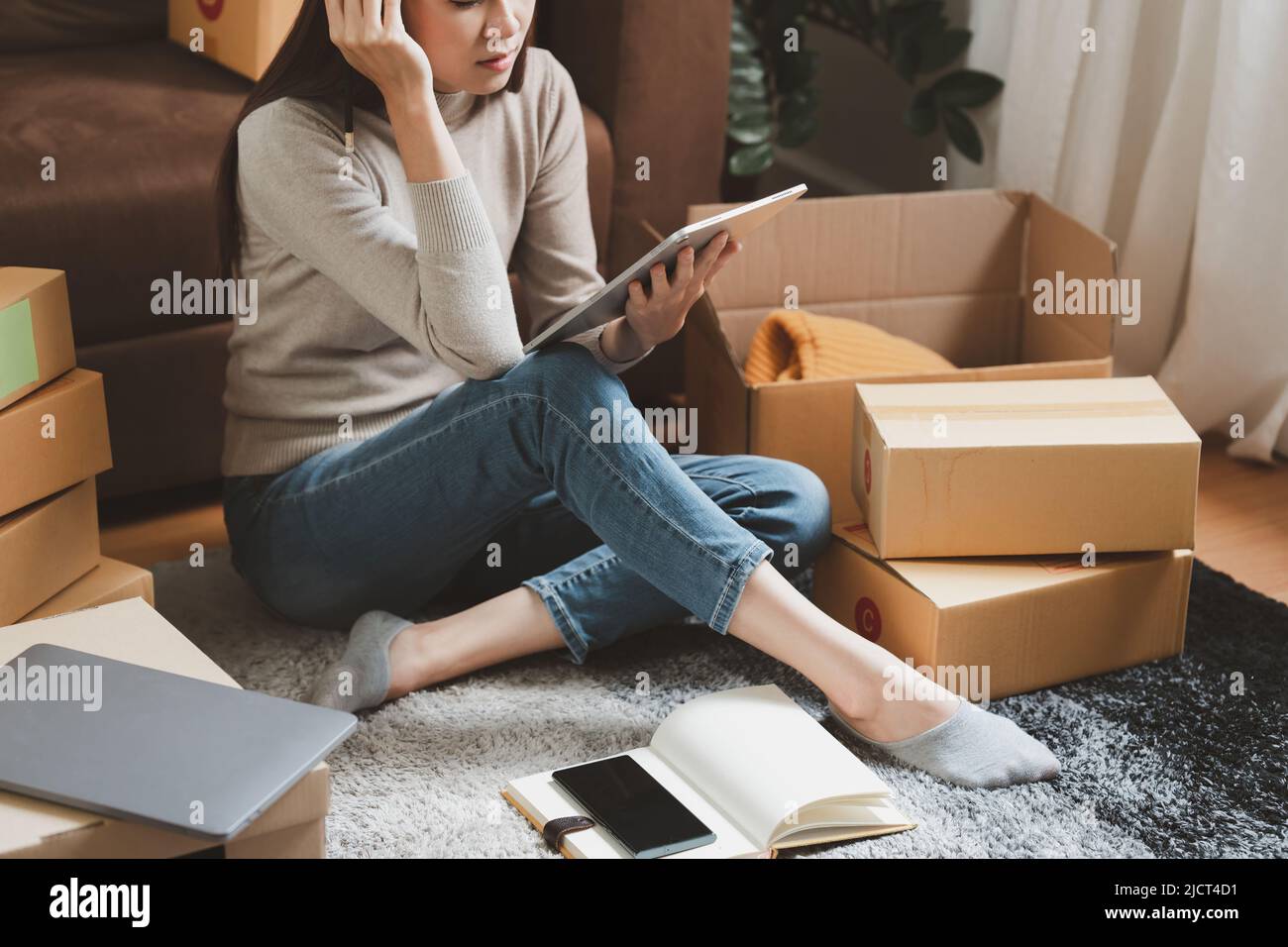 Asian small business owner working at home office. Business retail ...