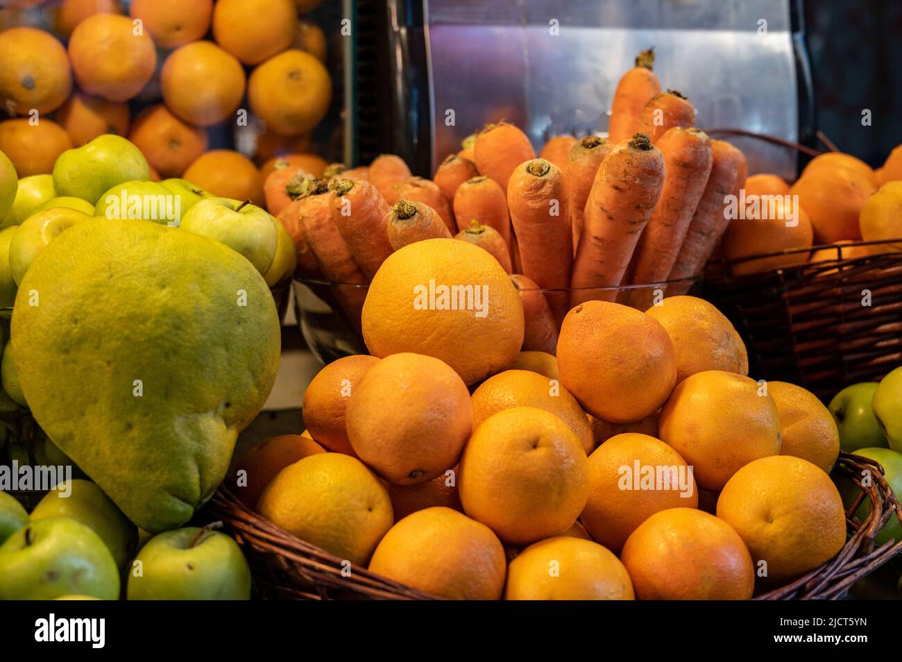 Fruits are harvested and stacked on the counter in the market for ...