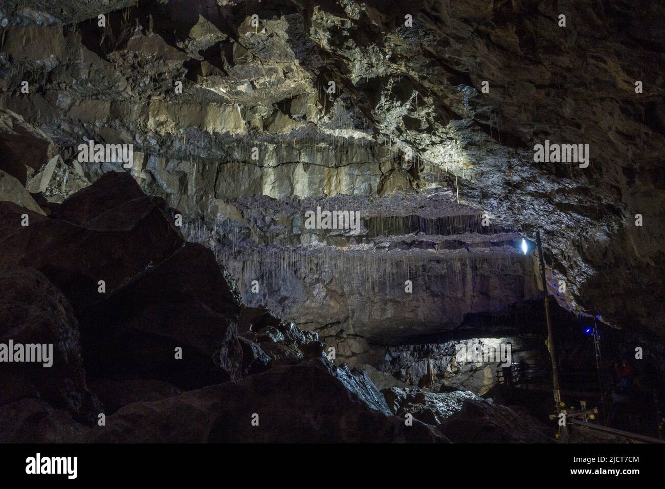 Visitors in hard hats inside Battlefield Cavern in the stunning White ...