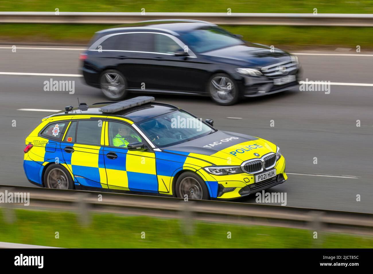 Police TAC OPs (Tactical Operations) BMW patrol car driving on the M6 ...