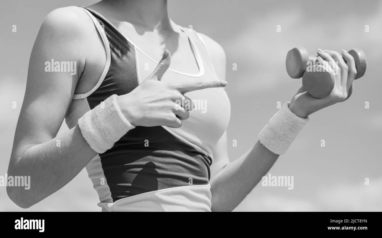 Dumbbell. Fit female exercising muscles. Sports fitness girl. Muscles ...