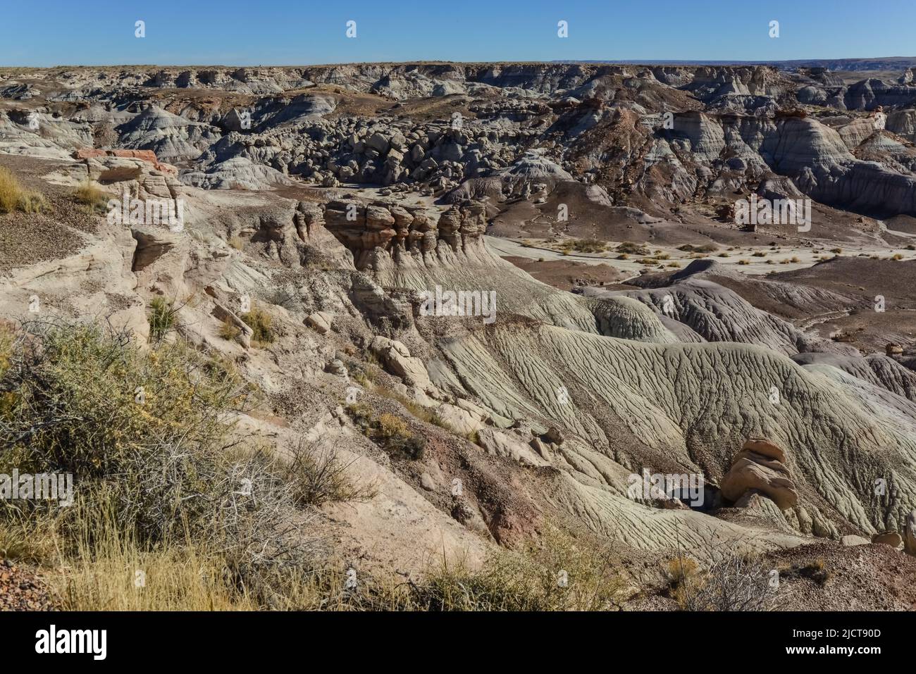The Painted Desert on a sunny day. Diverse sedimentary rocks and clay ...