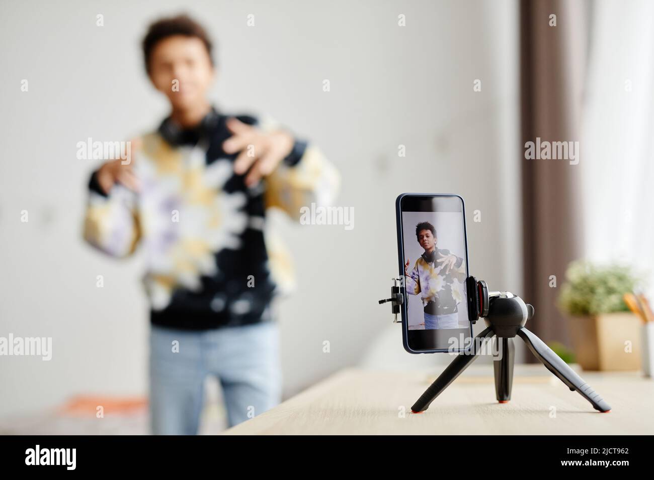 Background image of Gen Z teenager filming video for social media at ...