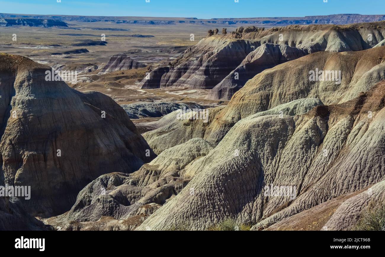 The Painted Desert on a sunny day. Diverse sedimentary rocks and clay ...