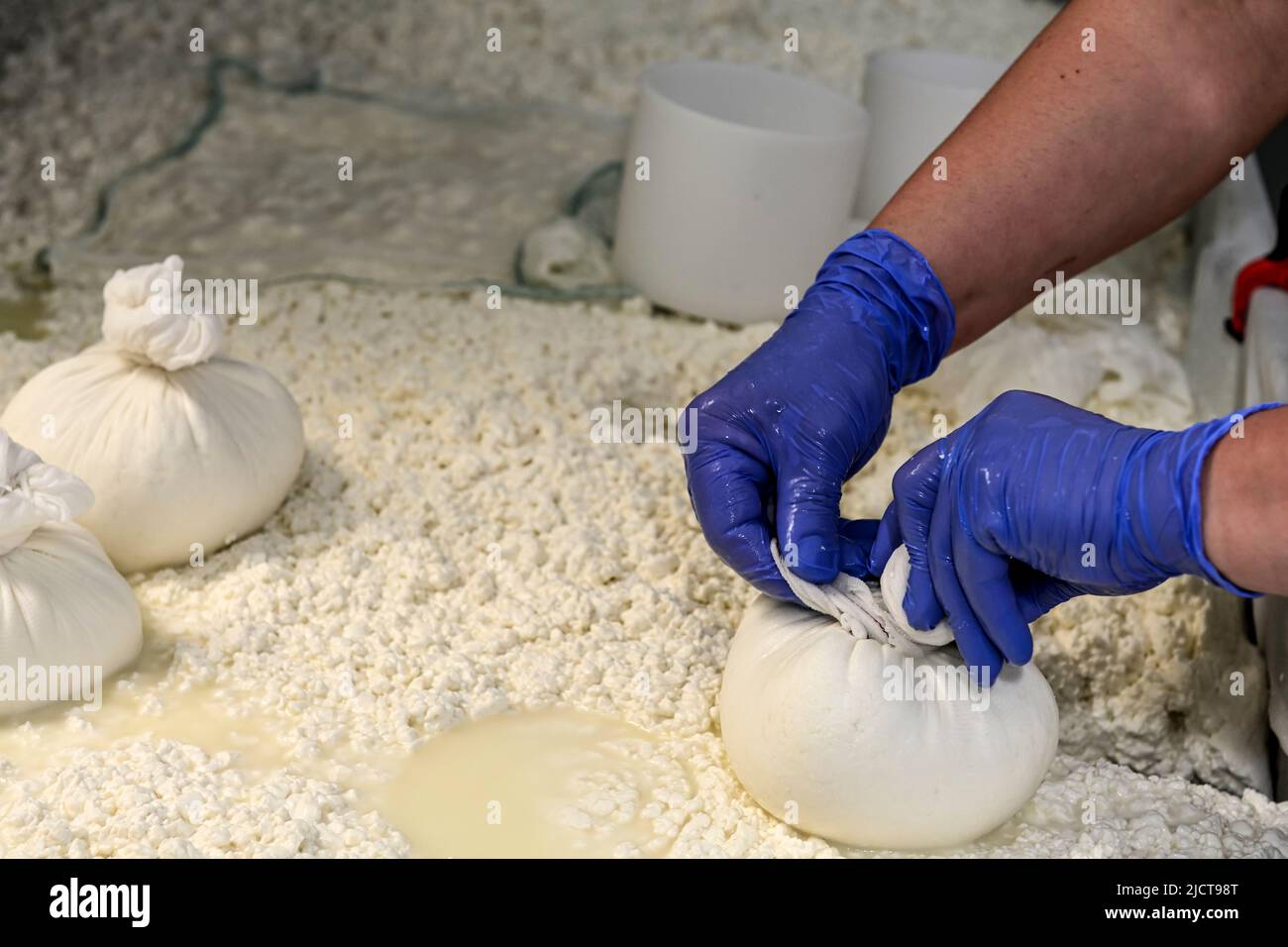 Filling the molds by hand Stock Photo - Alamy