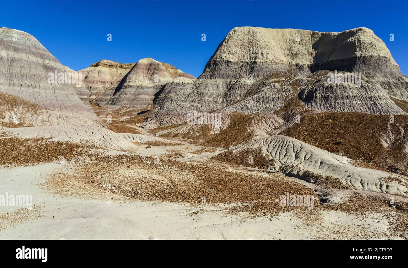 The Painted Desert on a sunny day. Diverse sedimentary rocks and clay ...