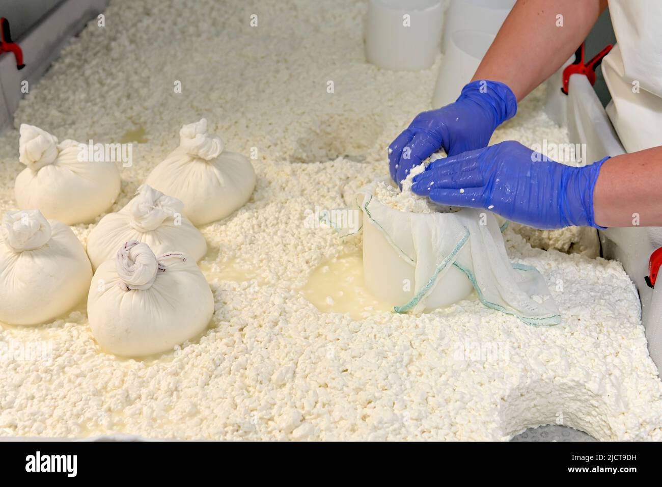 Filling the molds by hand Stock Photo - Alamy