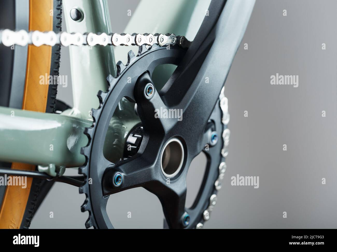 The leading star of a bicycle with a connecting rod and a chain close ...