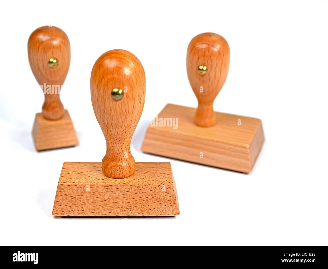 Various wooden stamps against white background Stock Photo - Alamy