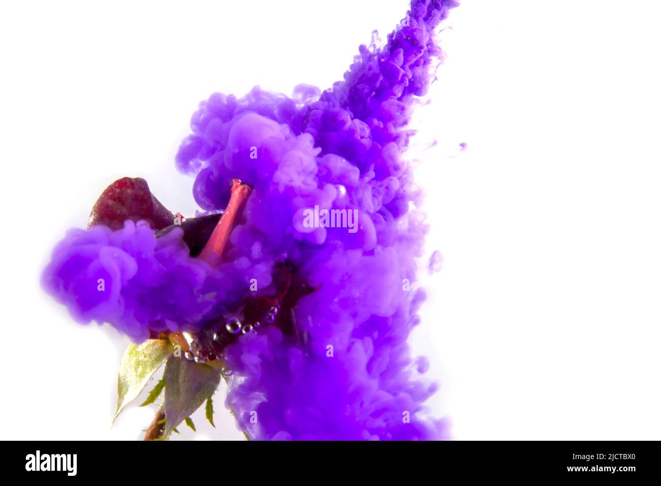 Color drop in water isolated on white background Stock Photo - Alamy