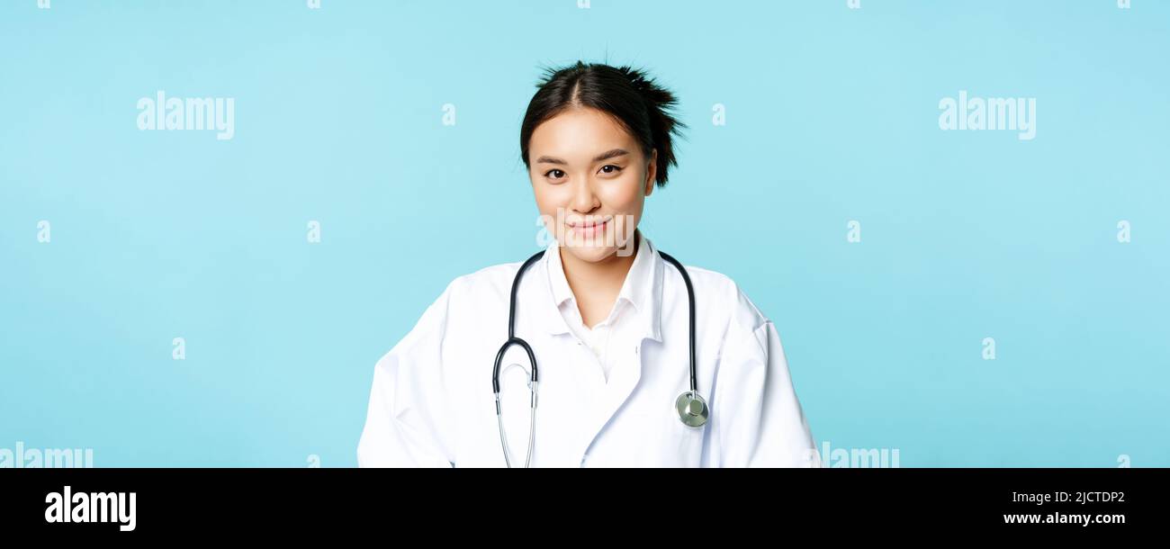 Healthcare and medical concept. Korean female doctor, nurse in uniform ...
