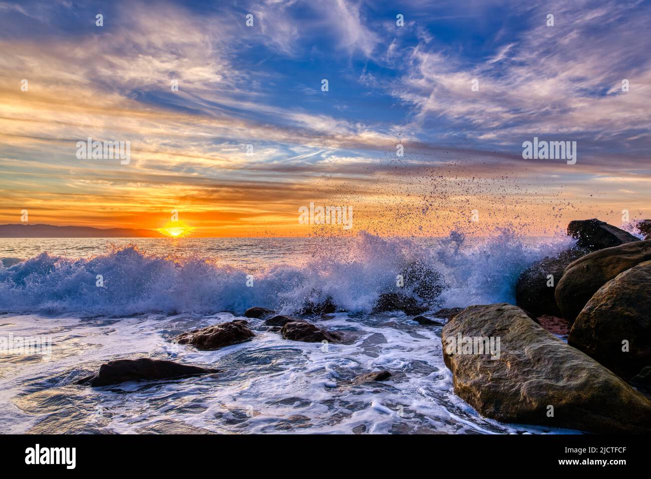 A Sunrise Back Lit Ocean Wave Is Breaking On The Beach Shore In High ...
