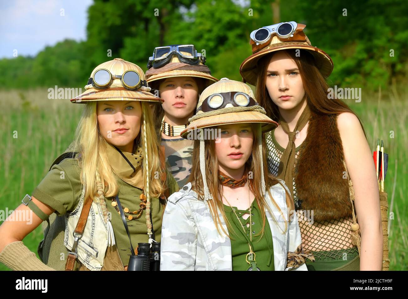 Four girls are seen as explorers. They are seen at their campsite in ...