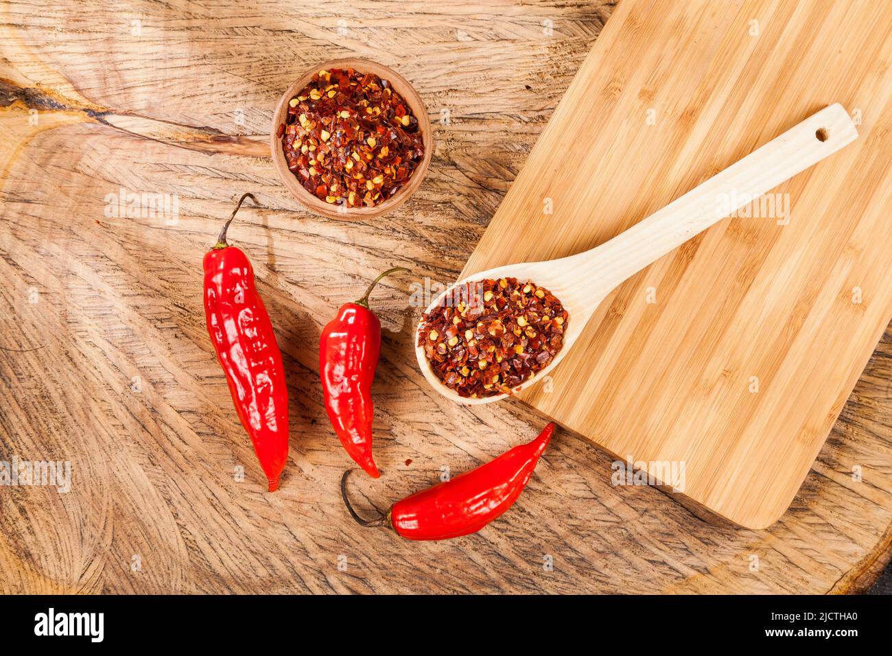 Red pepper or cayenne; Pepper crushed with flakes scattered Stock Photo ...