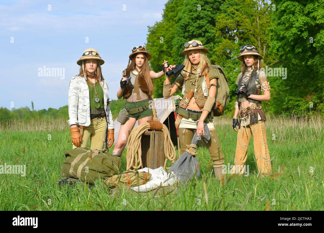 Four girls are seen as explorers. They are seen at their campsite in ...