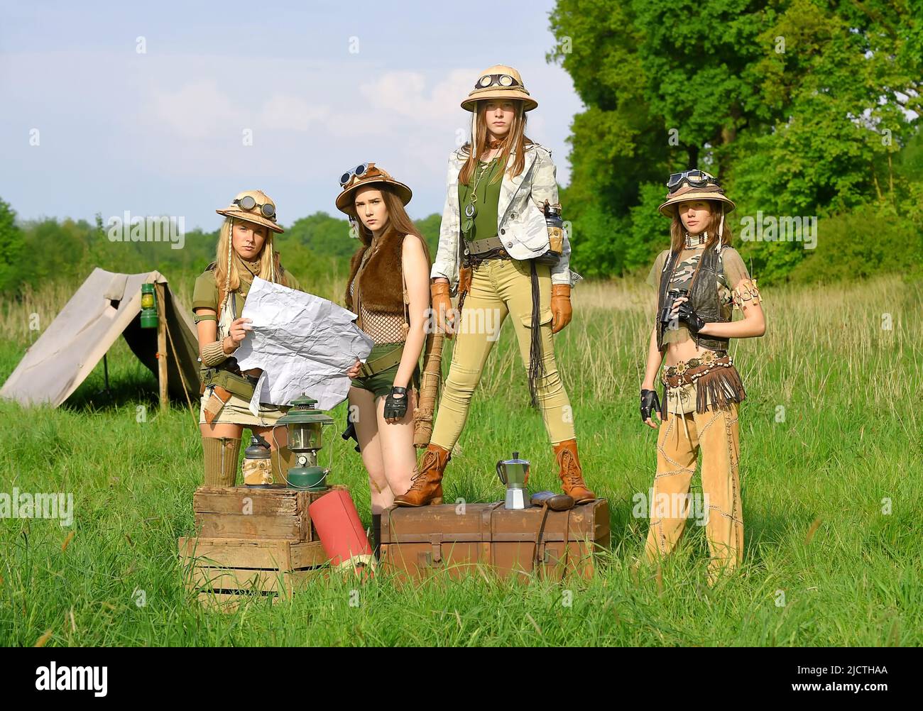 Four girls are seen as explorers. They are seen at their campsite in ...