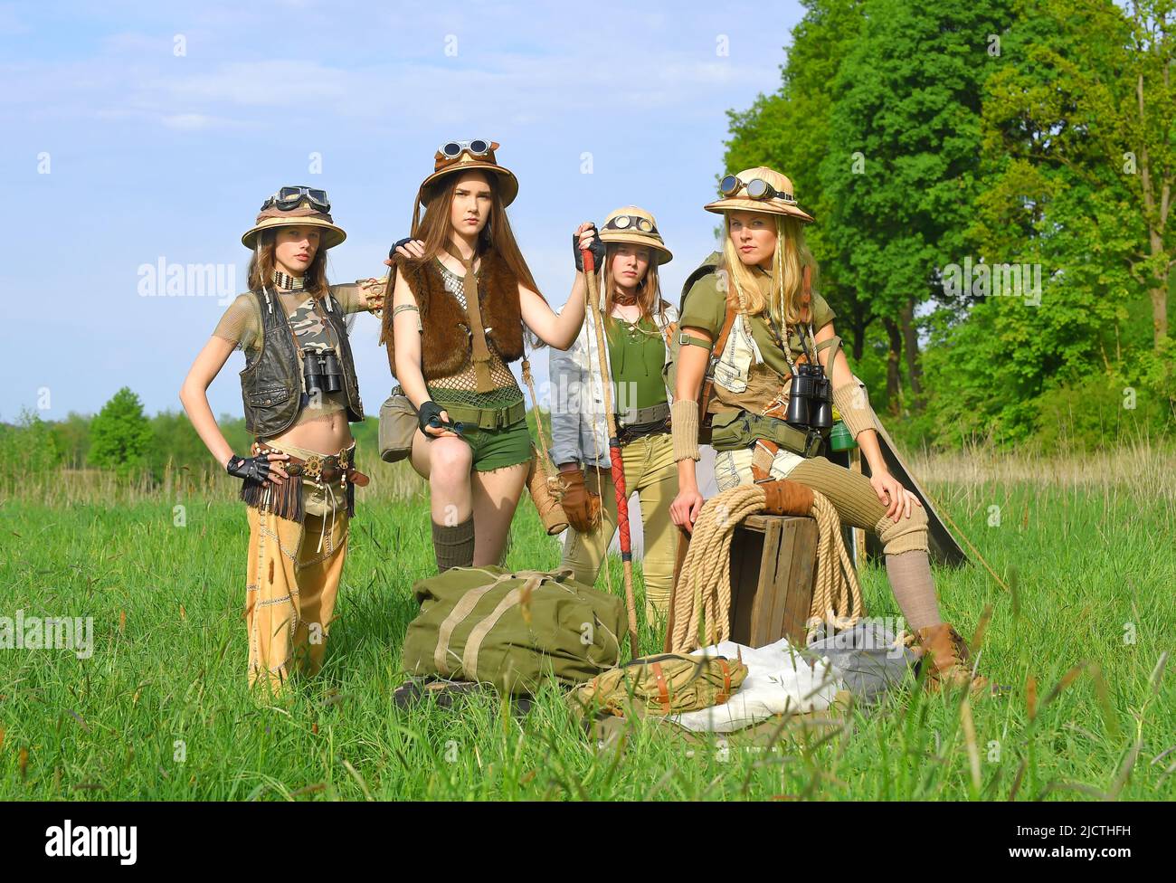 Four girls are seen as explorers. They are seen at their campsite in ...