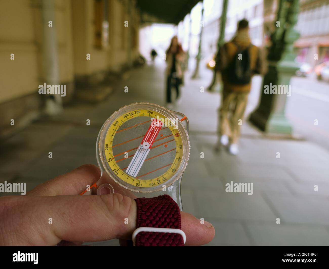 A compass in a person's hand. Orient yourself in the current situation ...