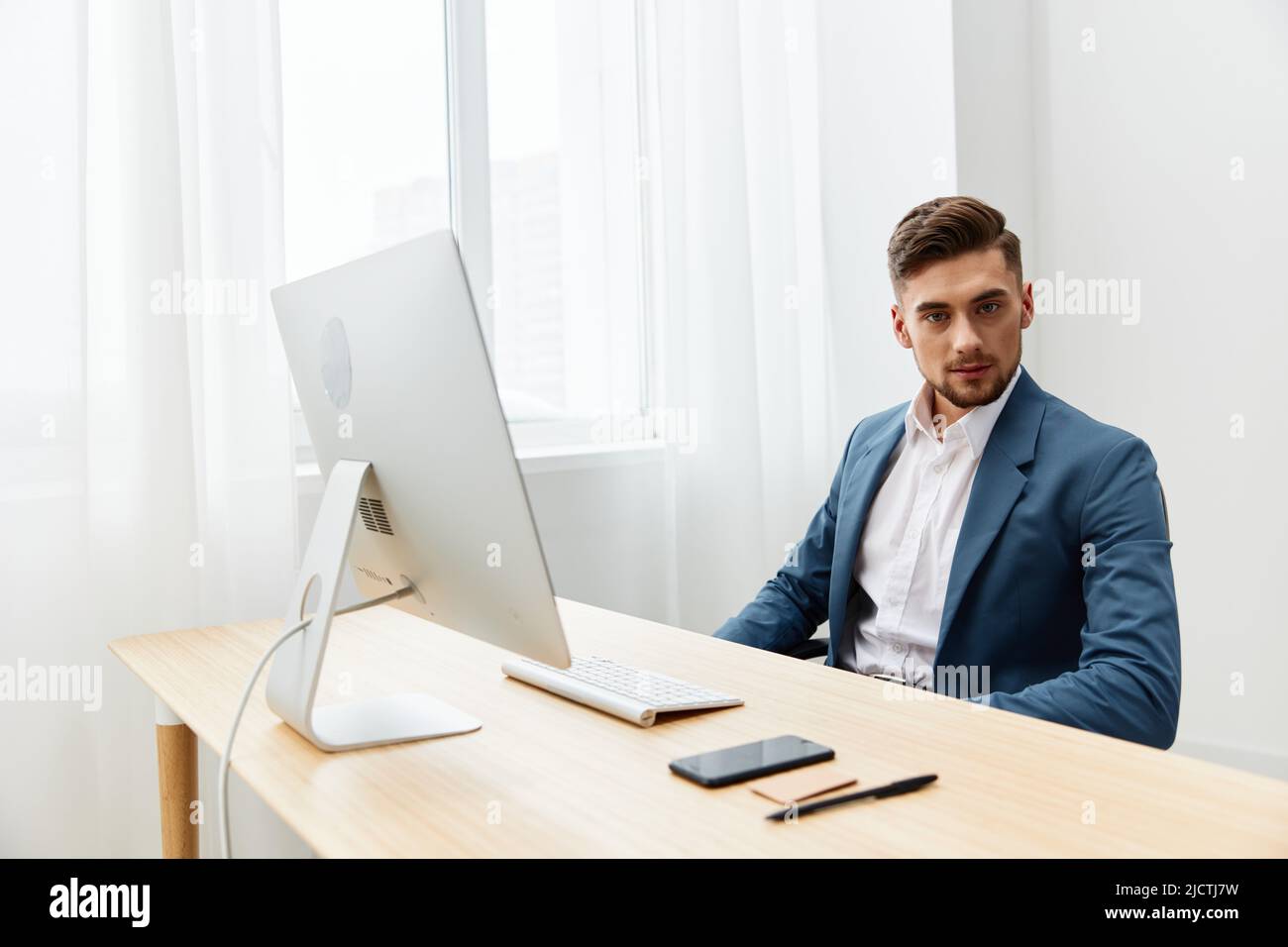 manager at the desk in the office an official Gray background Stock ...
