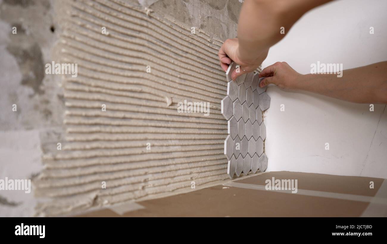 Mosaic tiles hands hi-res stock photography and images - Alamy