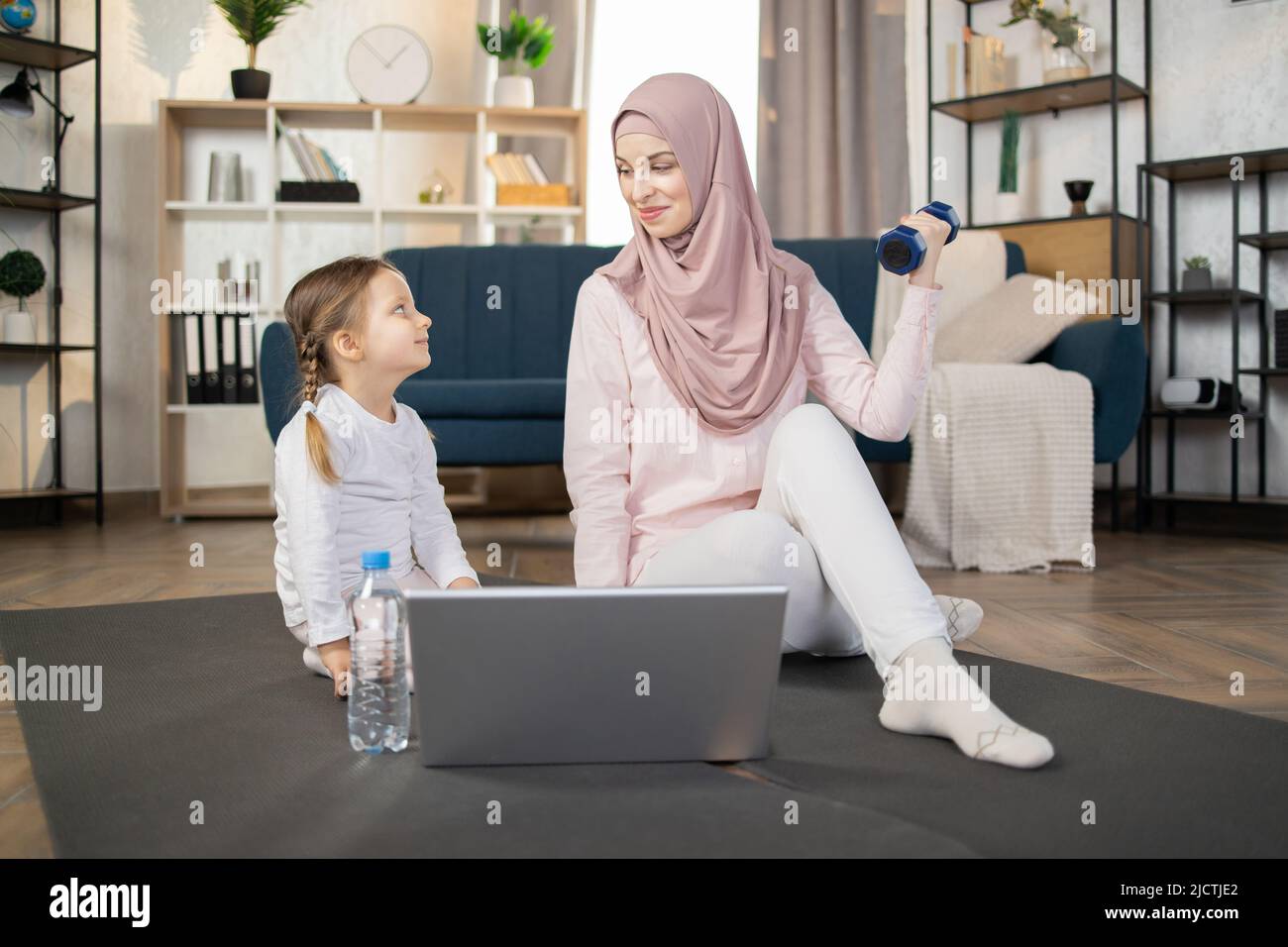 Mother watch child gymnastics hi-res stock photography and images - Alamy