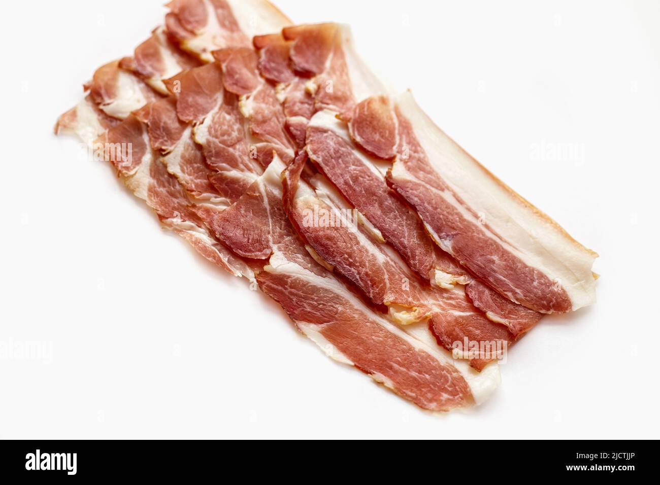 Parma ham slices isolated on white Stock Photo - Alamy