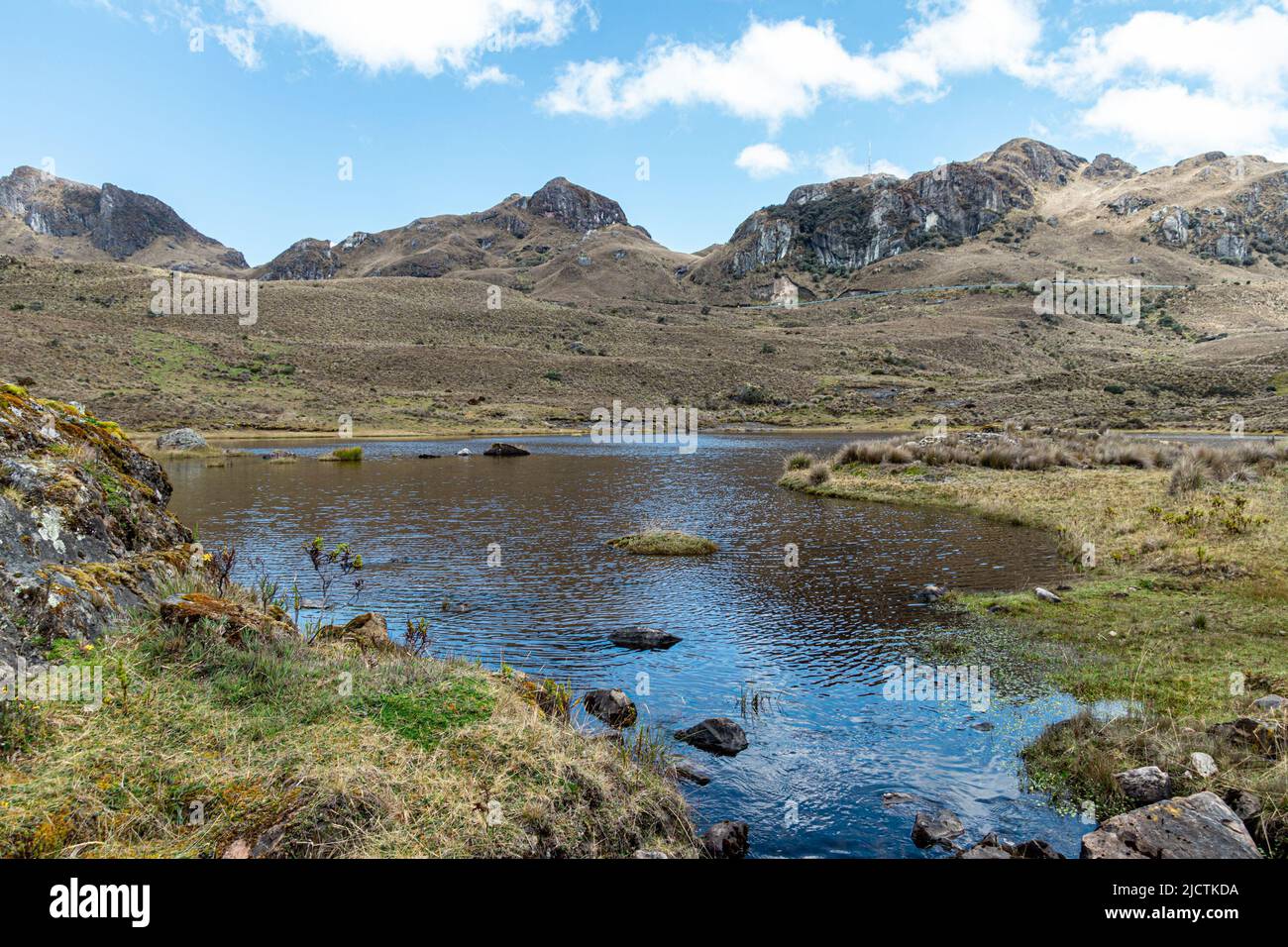 Mountain lake Apicocha in Cajas National Park on sunny day, Toreadora ...