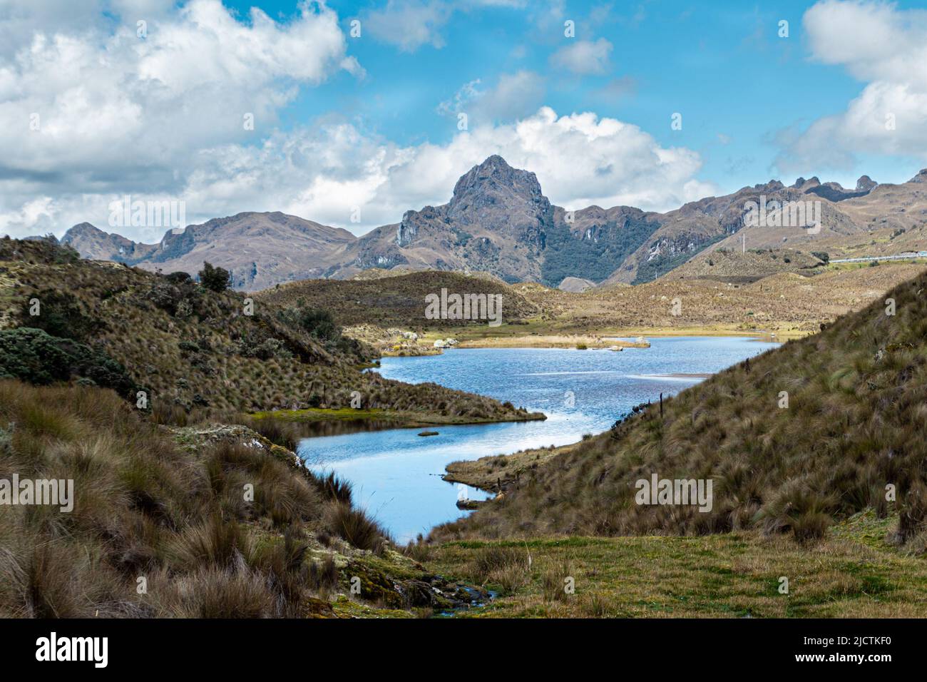 Cajas National Park on sunny day. Mountain lake Apicocha and mountain ...