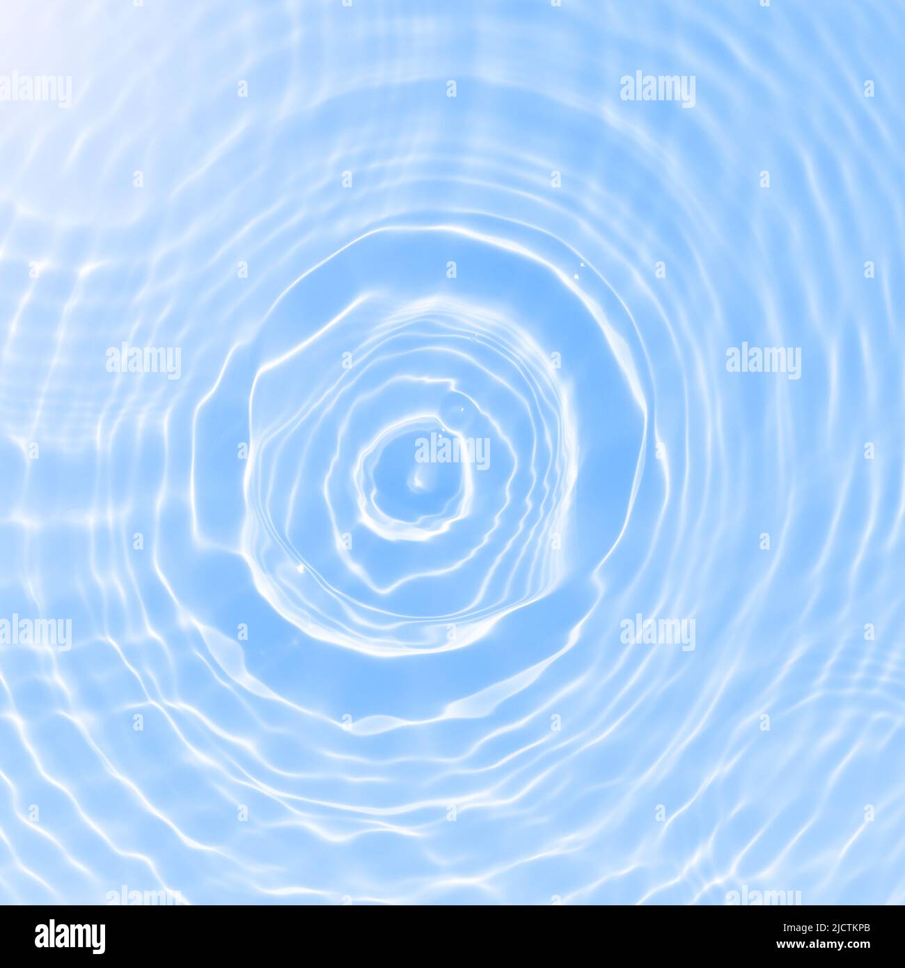 Blue Water texture with sun reflections and water circles on the water ...