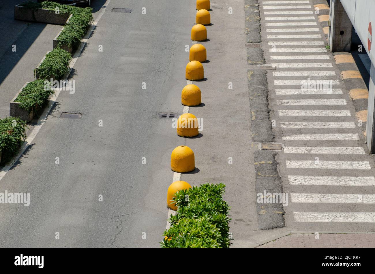 Road with separate and evident pedestrian path with black and white ...