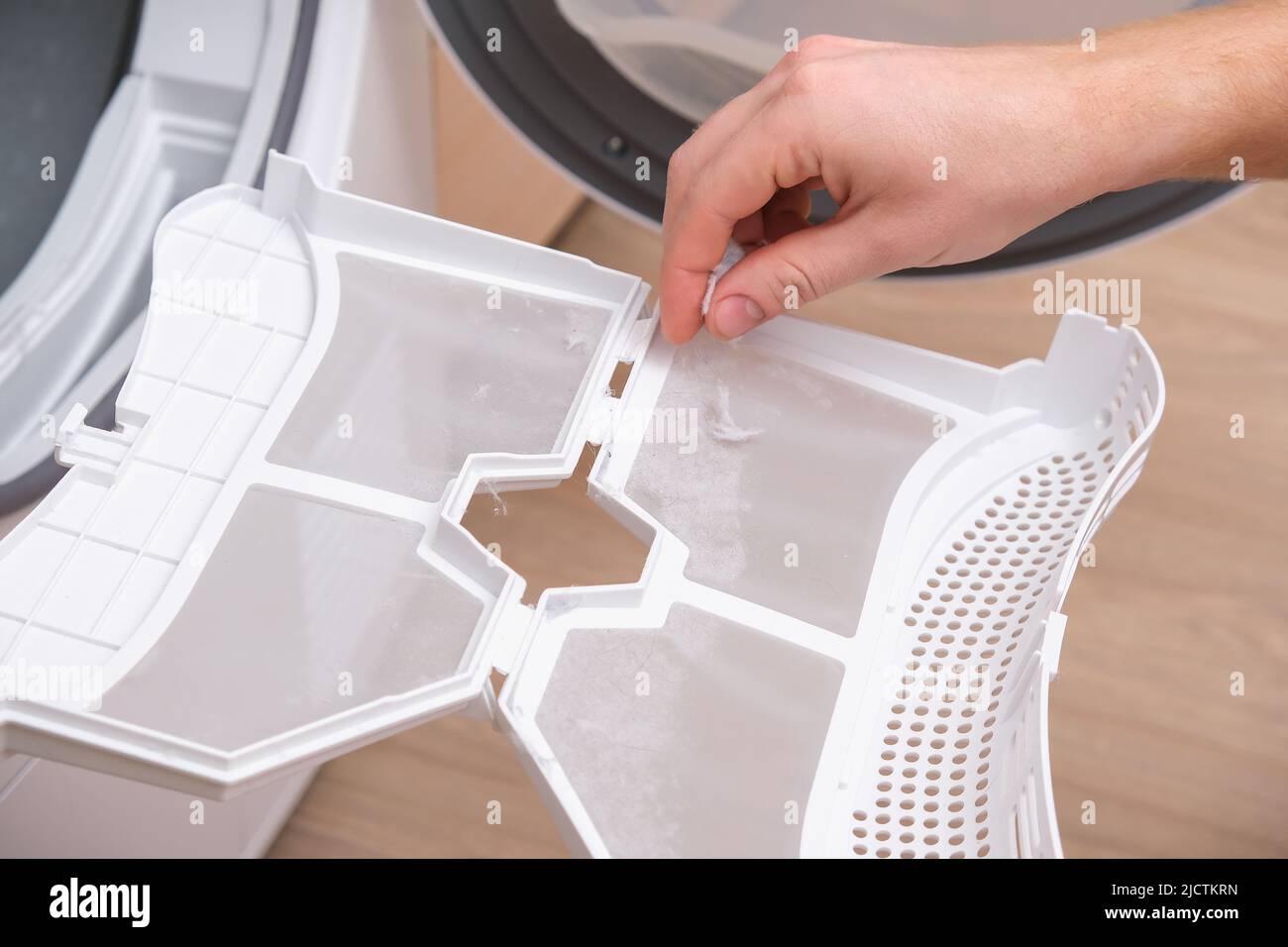 Remove clothes from dryer hi-res stock photography and images - Alamy