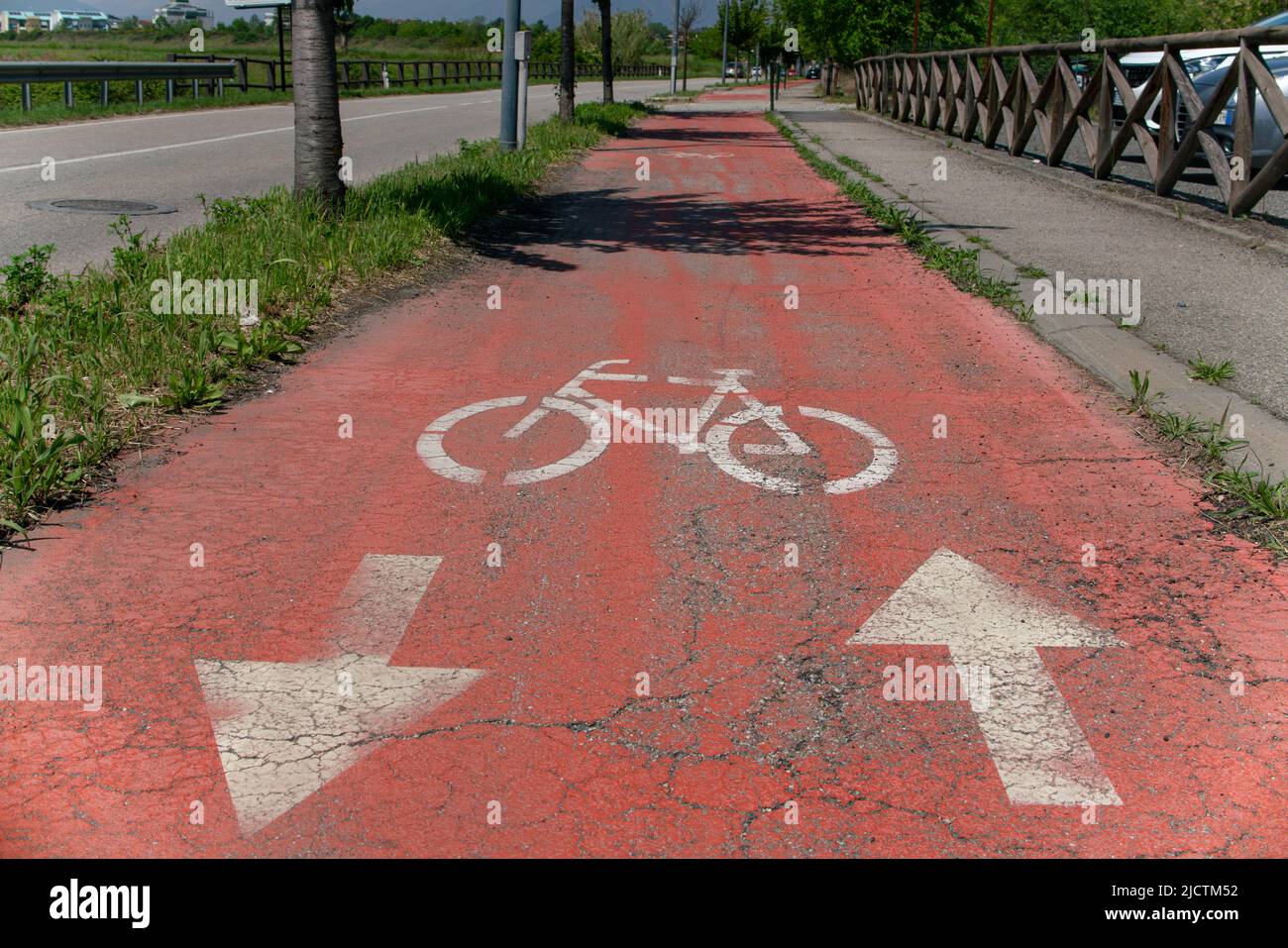 cycle path, road symbol of the bicycle, with red asphalt to highlight ...