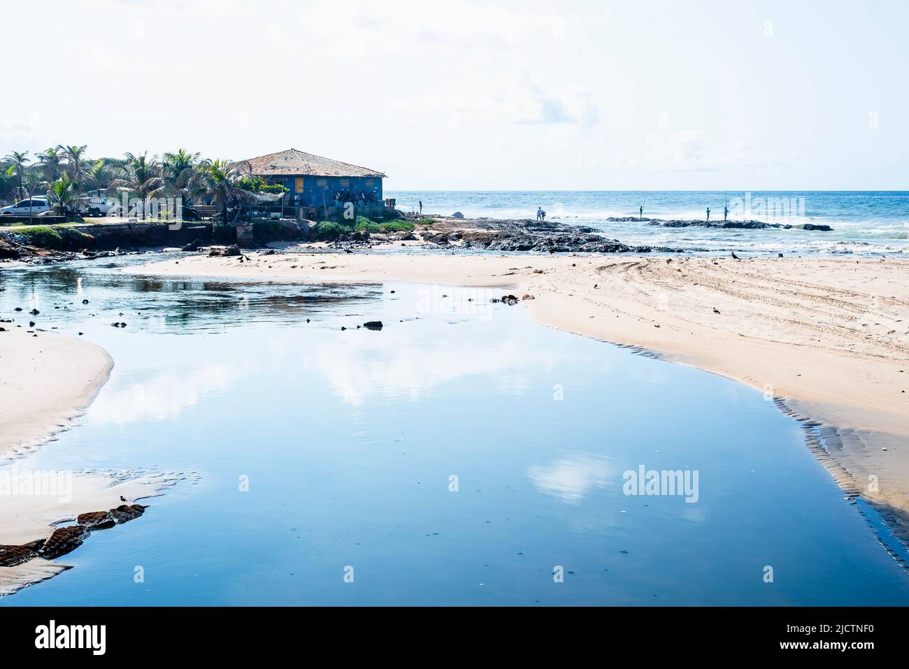 View of the river that flows into Boca do Rio beach in Salvador in the ...