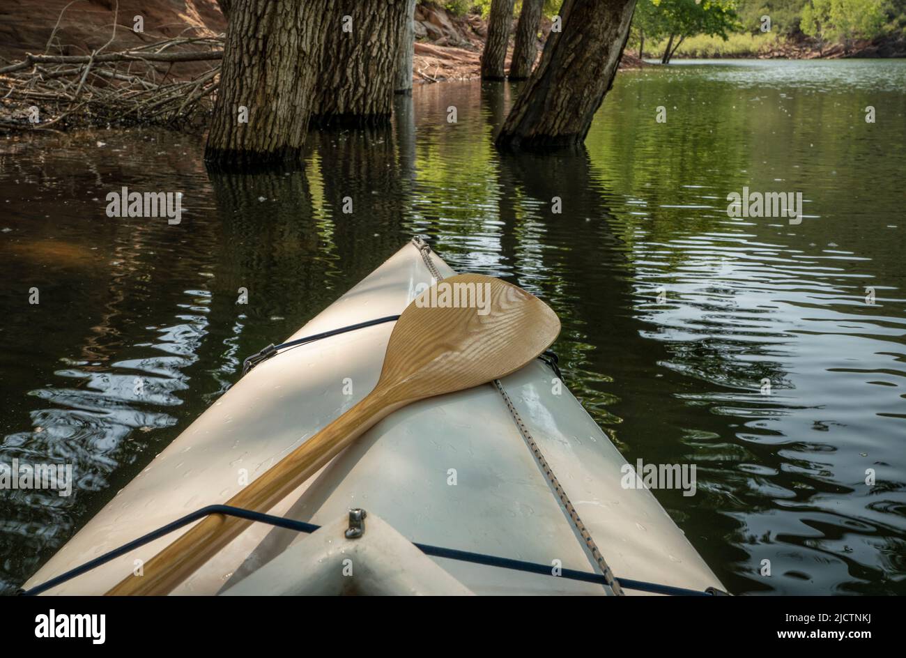 Canoe bow paddle on lake hi-res stock photography and images - Alamy
