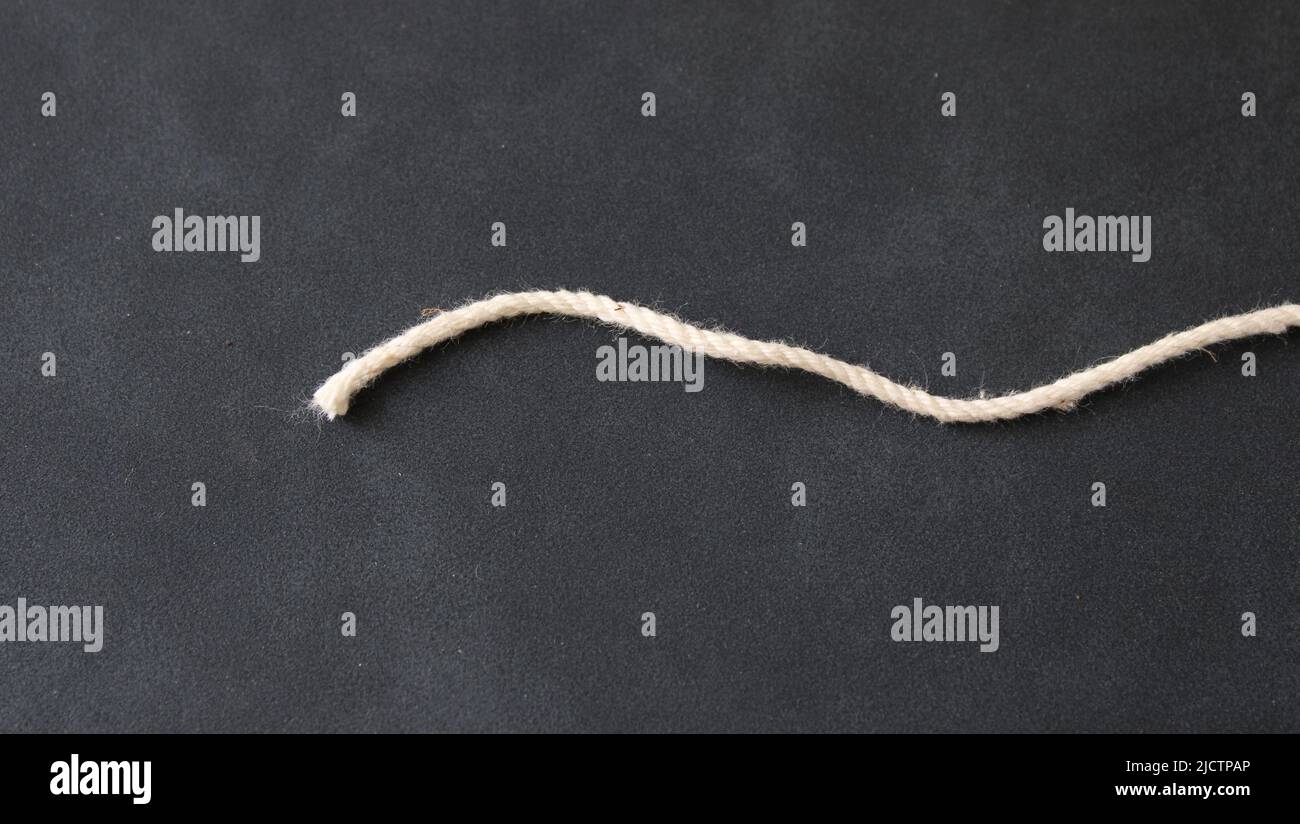 A Single Piece of White String on a Grey-Blue Background Stock Photo ...