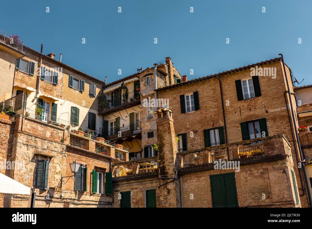 Old medieval buildings in Siena city center, Tuscany, Italy Stock Photo ...