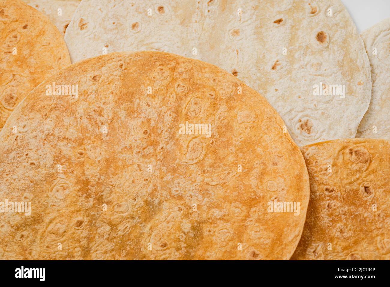 Tomato flavored and plain wheat tortilla wraps. Spanish or Mexican ...