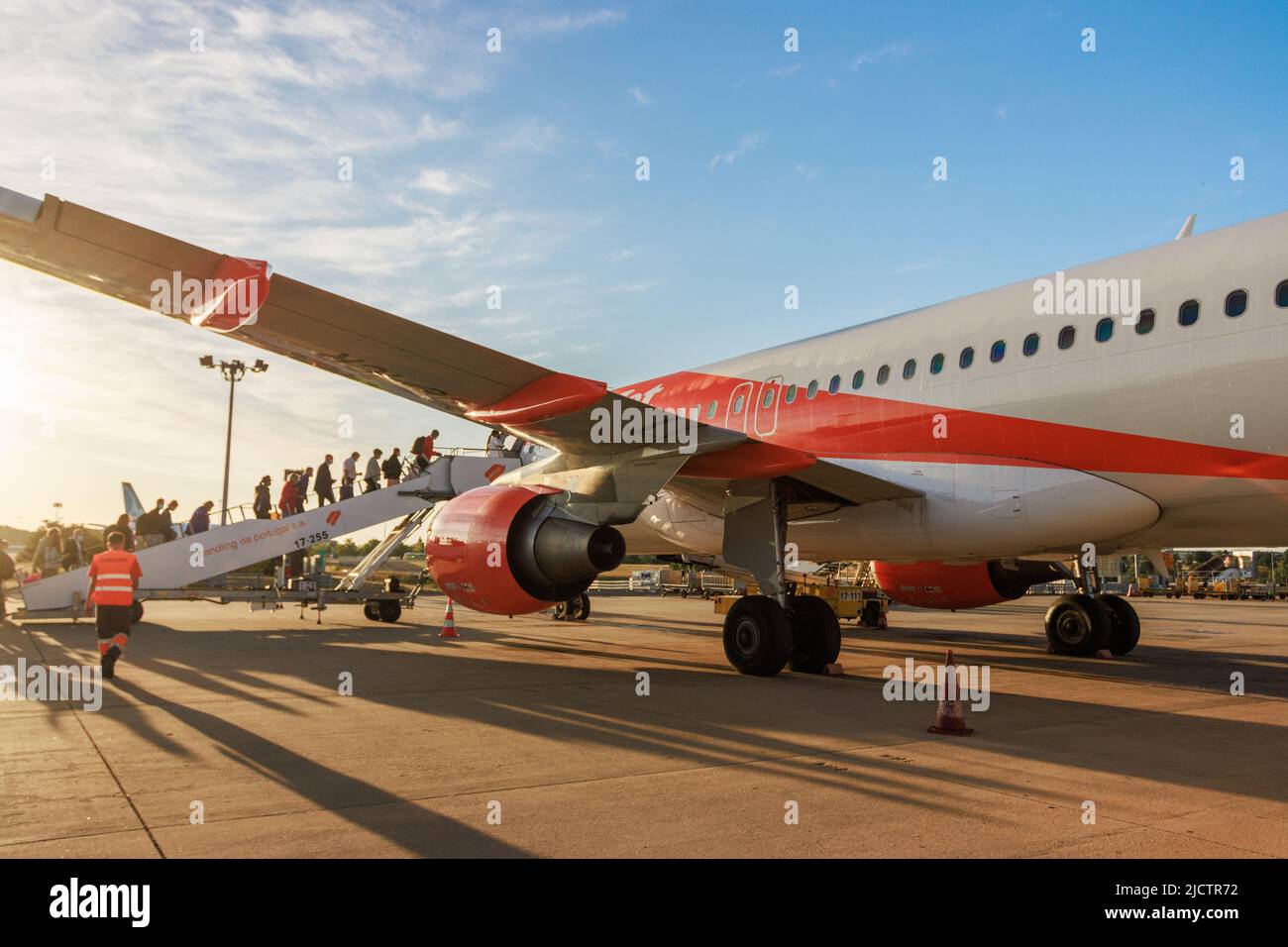 Passengers boarding an Easyjet plane in the early morning at Lisbon ...