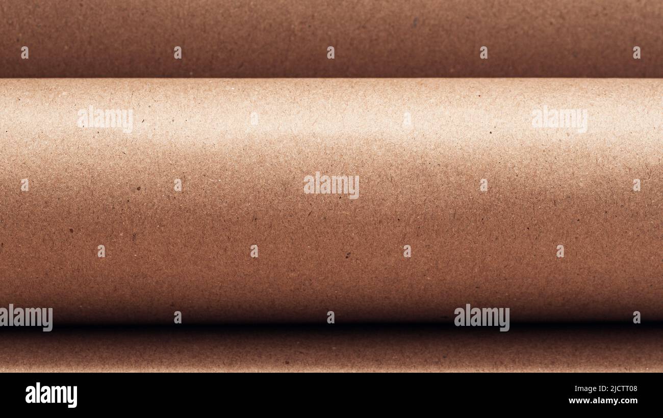 Rolled sheet textured craft paper close-up. Abstract background, copy ...