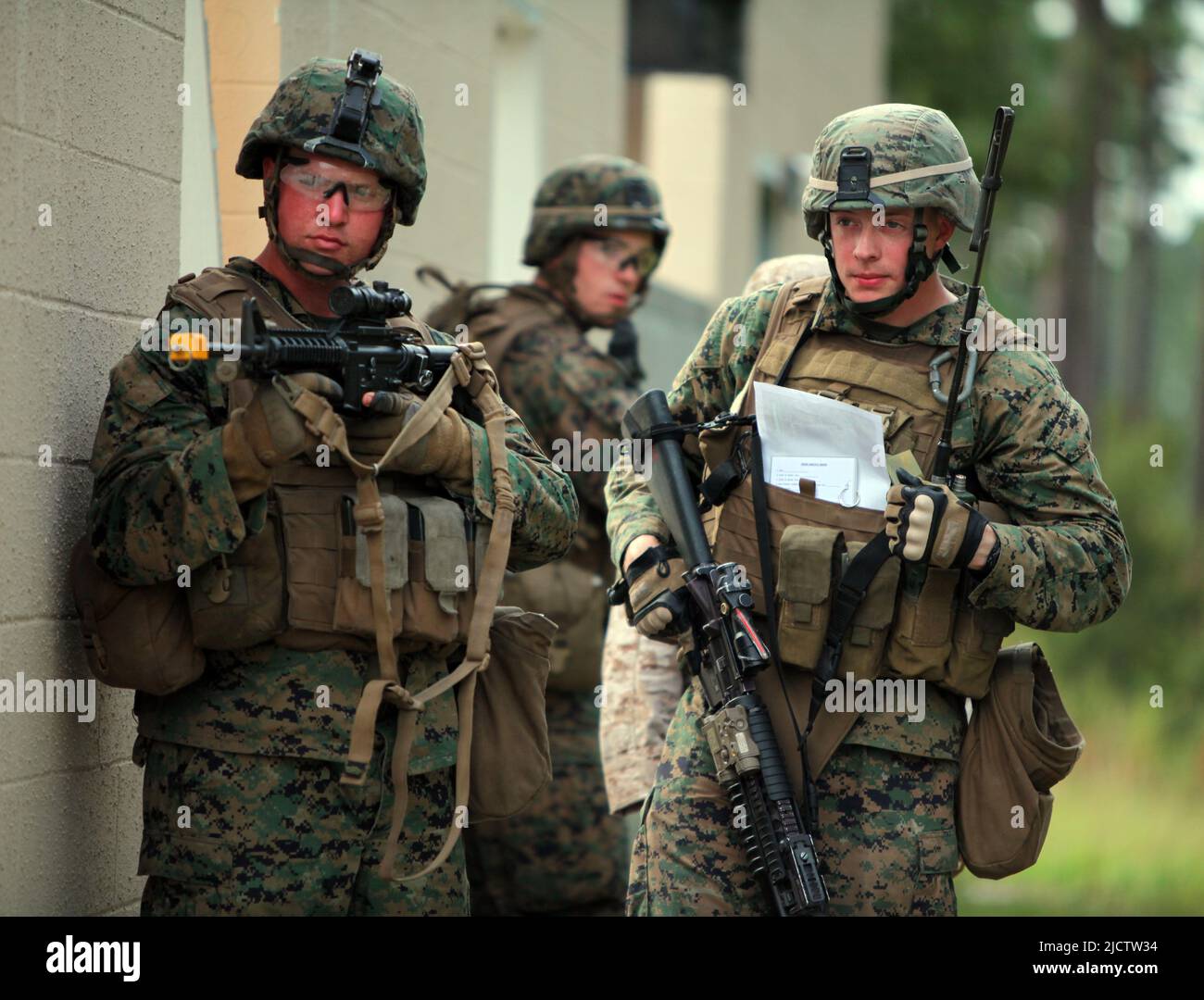 U.S. Marines with 1st Battalion, 8th Marine Regiment (1/8), 2D Marine Division, clears his ...