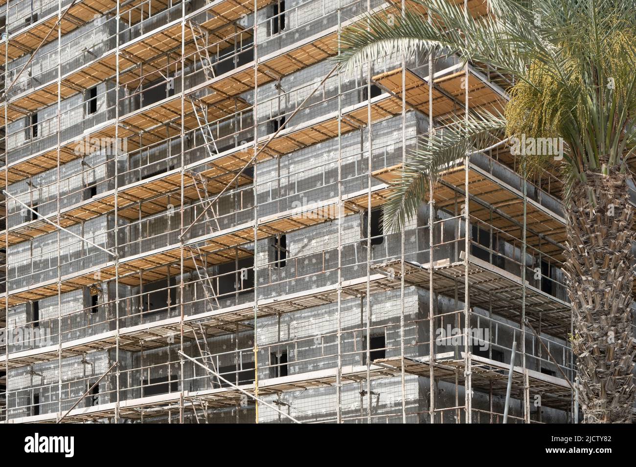 Scaffolding on the construction site in Israel. Modern Apartments ...