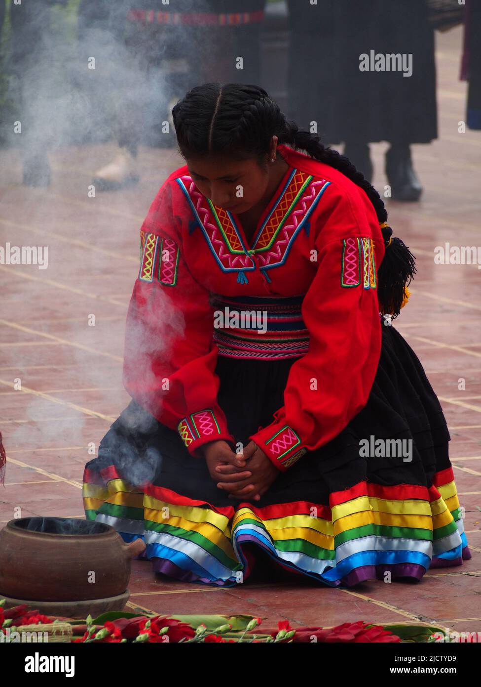 Bolivian and Mapuche indigenous girls burning incense when a hundred ...