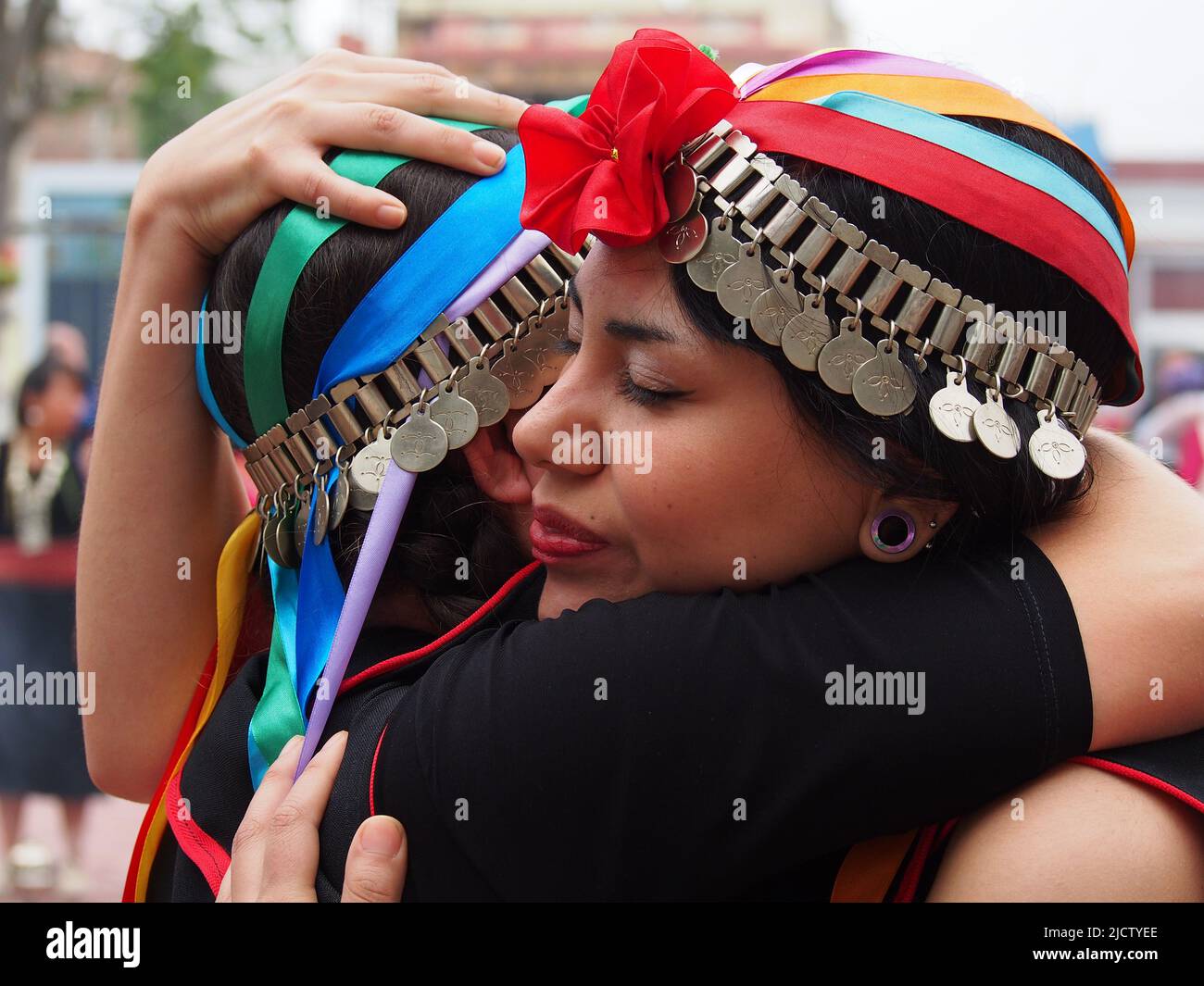 Mapuche women embrace each other when a hundred indigenous women from ...