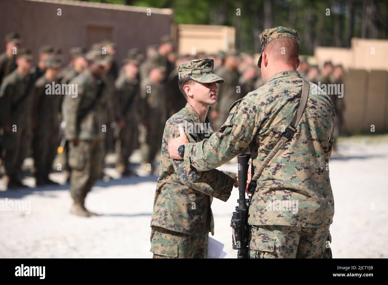 U.S. Marine Corps Corporal Christopher Metts (left) with Charlie Company, 1st Battalion, 8th ...